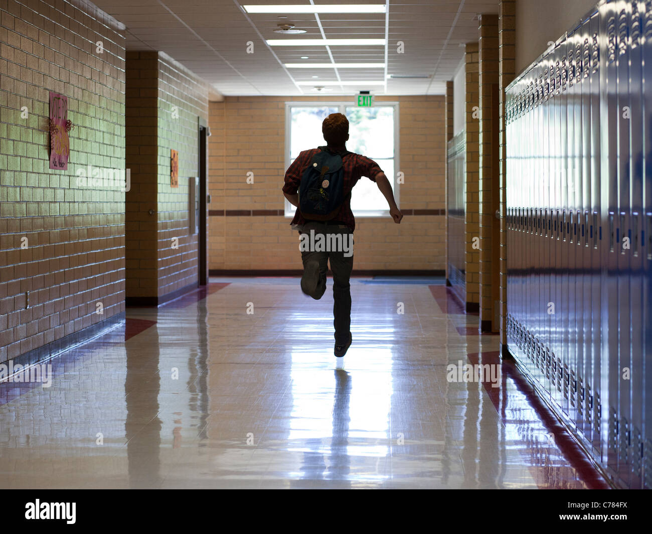 USA, Utah, Spanish Fork, School boy (16-17) running in corridor Stock ...