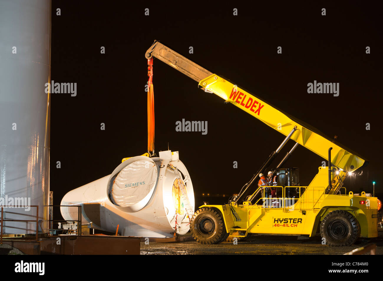 a jack up barge loading wind turbine parts on the docks at Mostyn for ...
