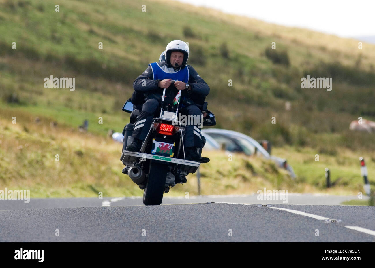 The Tour of Britain race cameraman on back of a motorcycle Stock Photo ...