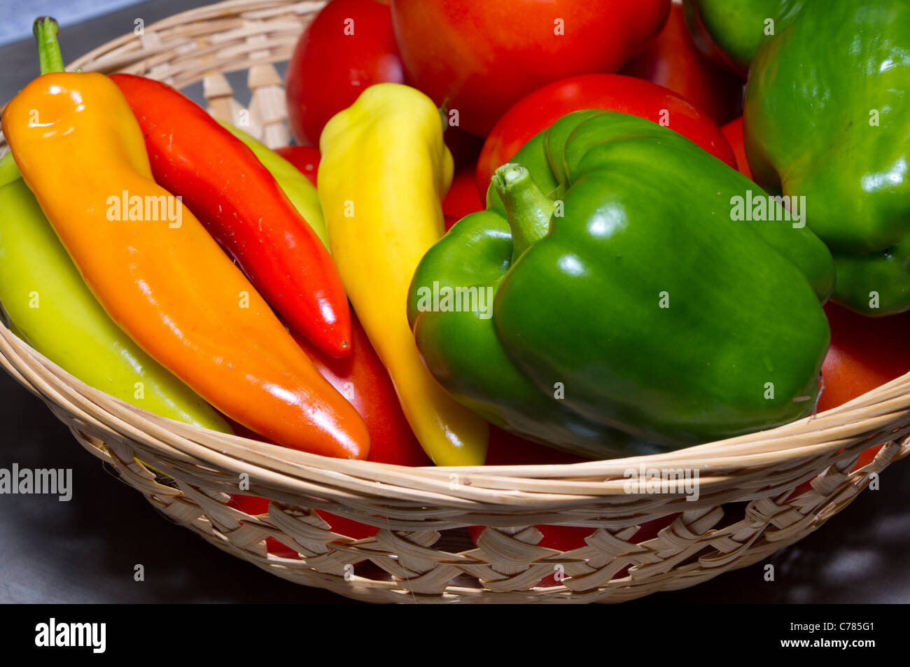 Basket with tomatoes and peppers from a garden Stock Photo - Alamy