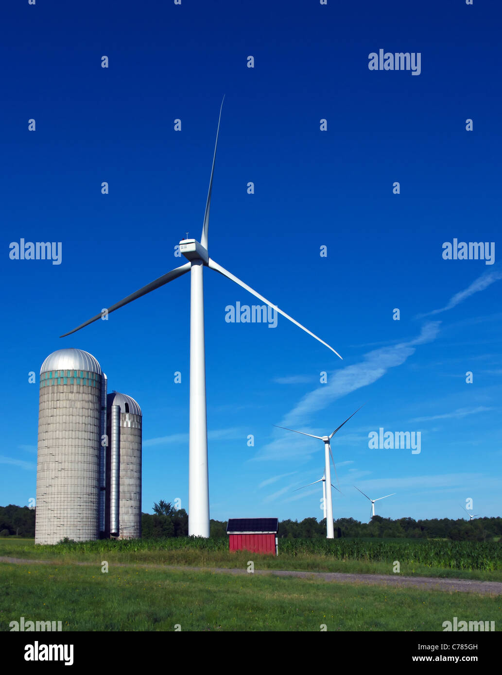 A Wind Turbine next to a farm silo Stock Photo - Alamy