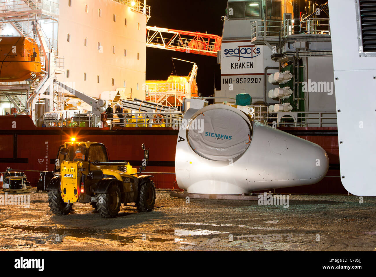 a jack up barge loading wind turbine parts on the docks at Mostyn for ...