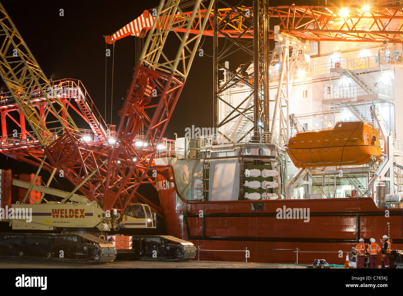 a jack up barge loading wind turbine parts on the docks at Mostyn for ...
