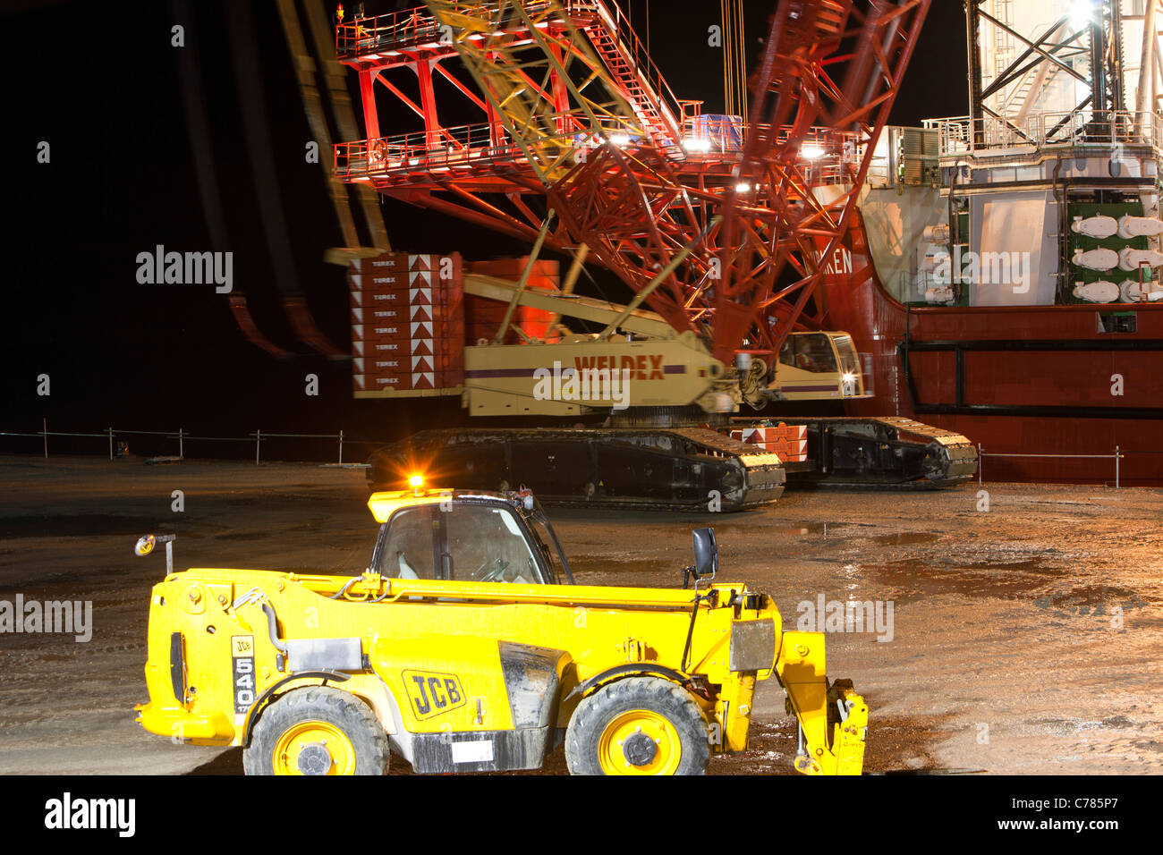a jack up barge loading wind turbine parts on the docks at Mostyn for ...
