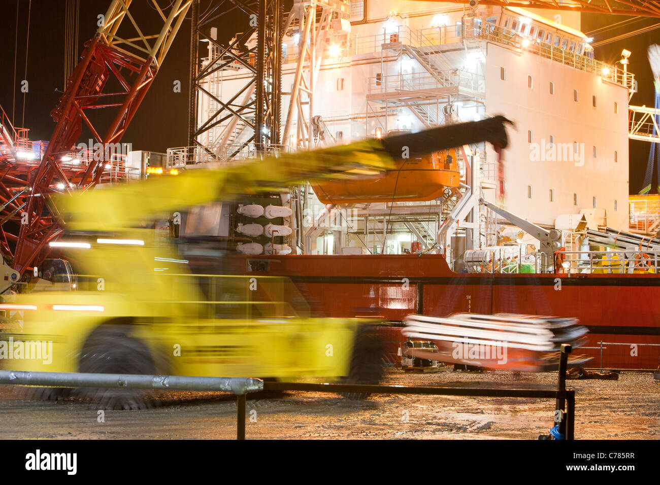 a jack up barge loading wind turbine parts on the docks at Mostyn for ...