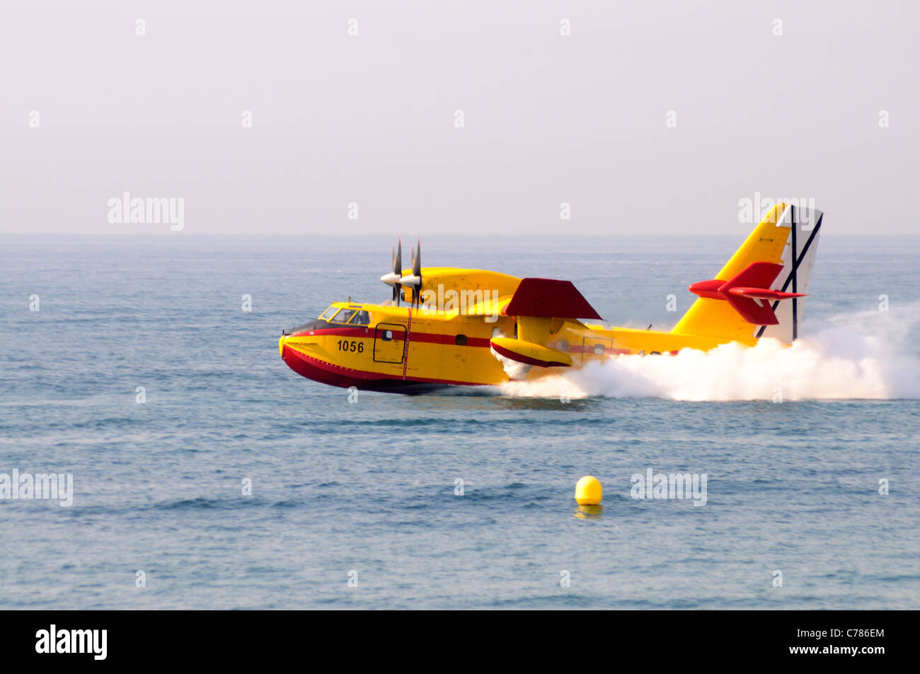 Bombardier/Canadair CL415 fire bomber scooping seawater, Calahonda ...
