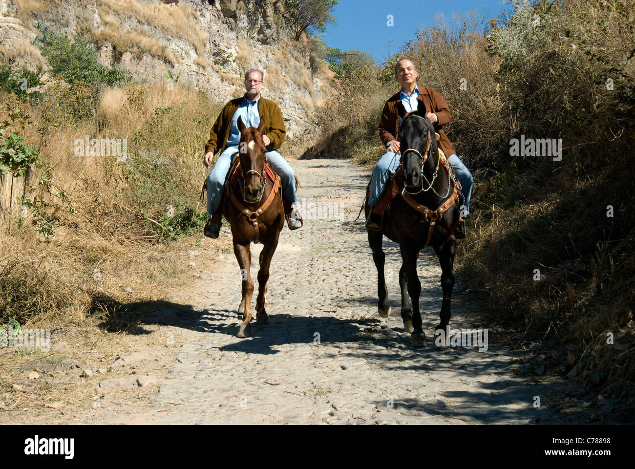 President Calderon rides horseback with Peter Greenberg on agave ...
