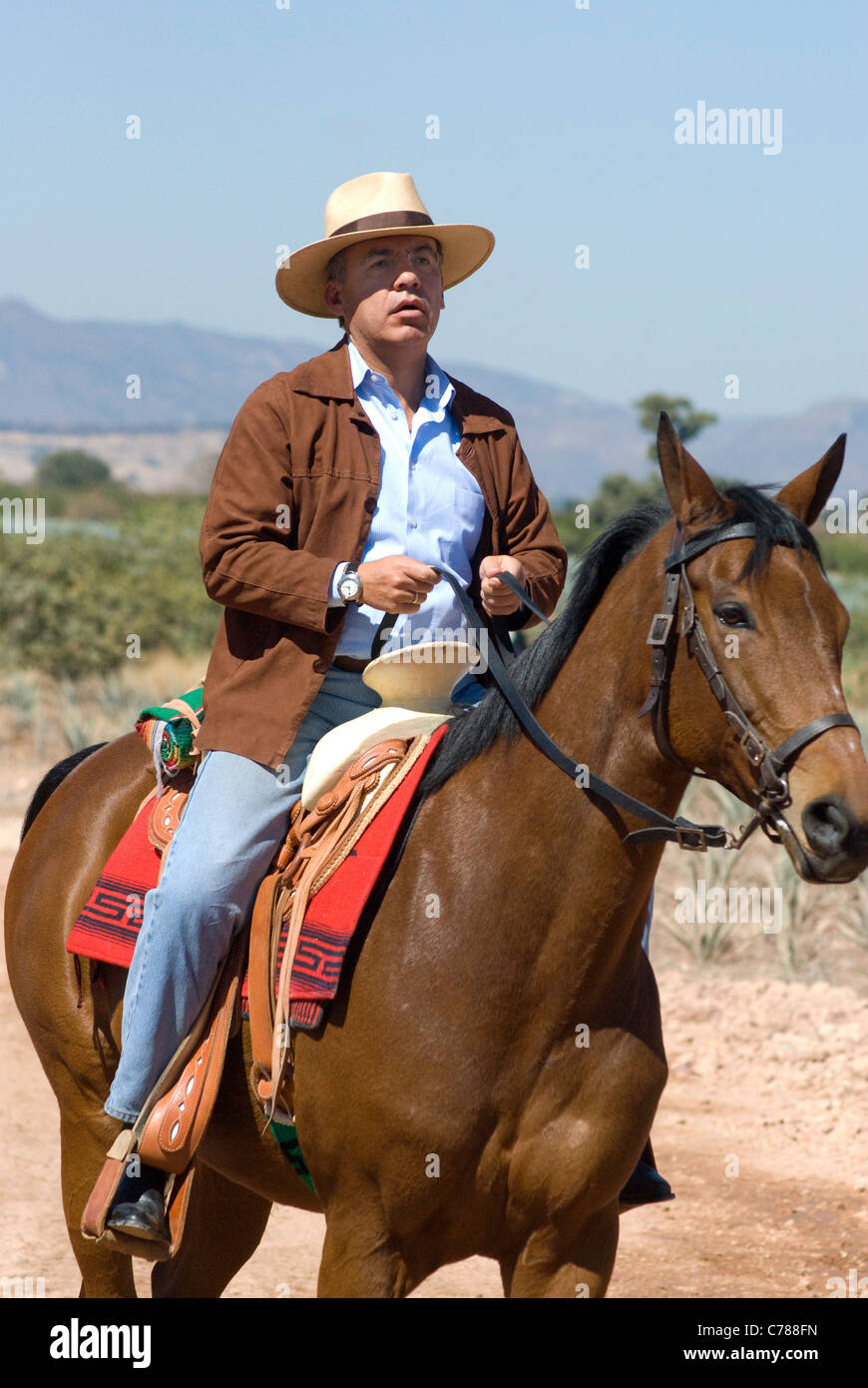 President Calderon rides horseback on agave plantation in Tequila ...