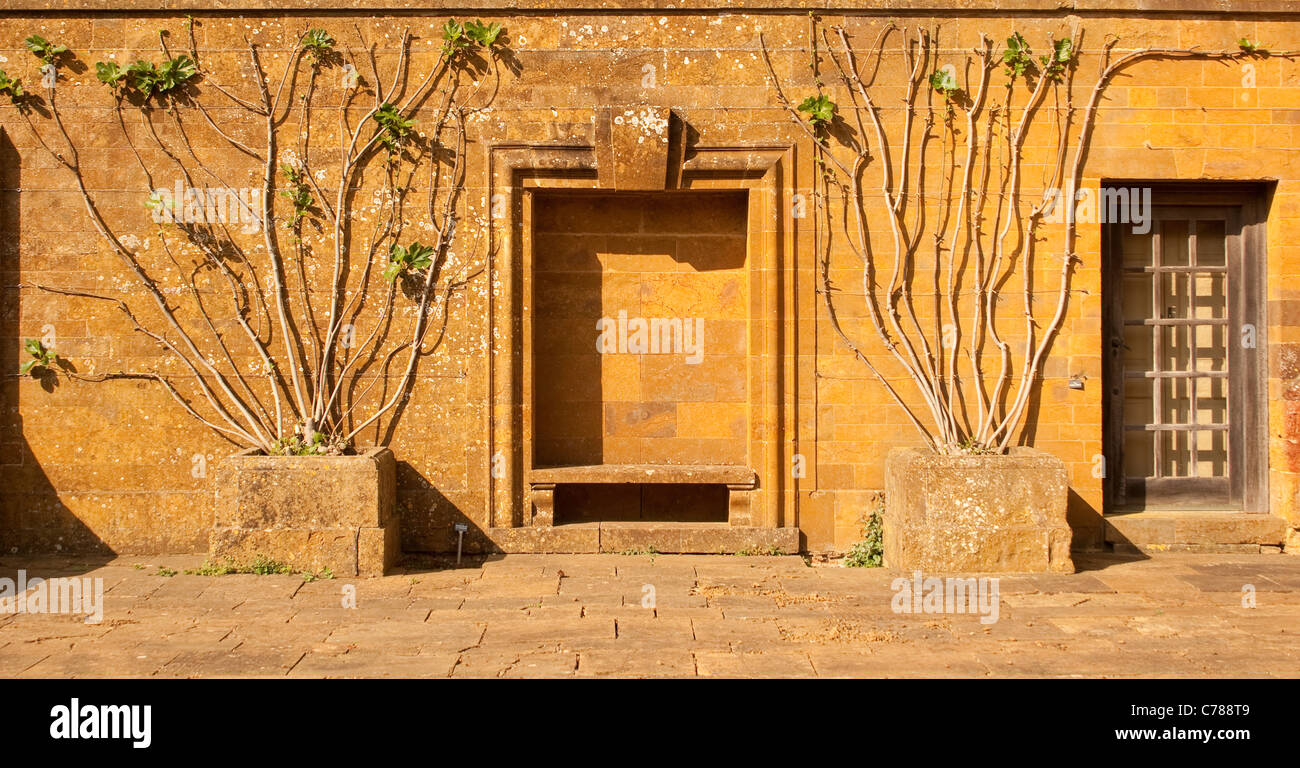 sandstone alcove building arch sun climbing plants trough blocks stone ...