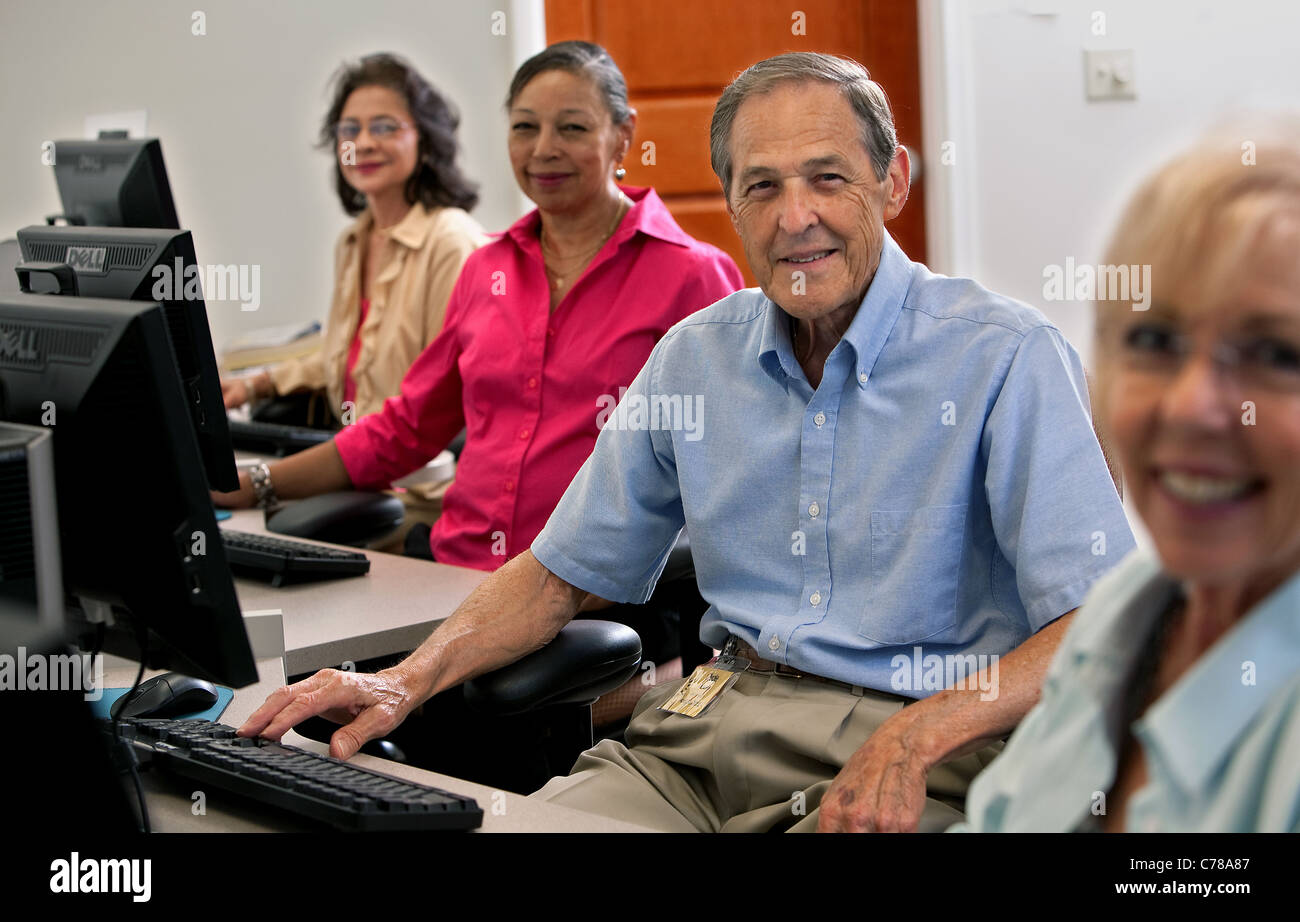 Senior citizens work on a computer Stock Photo - Alamy