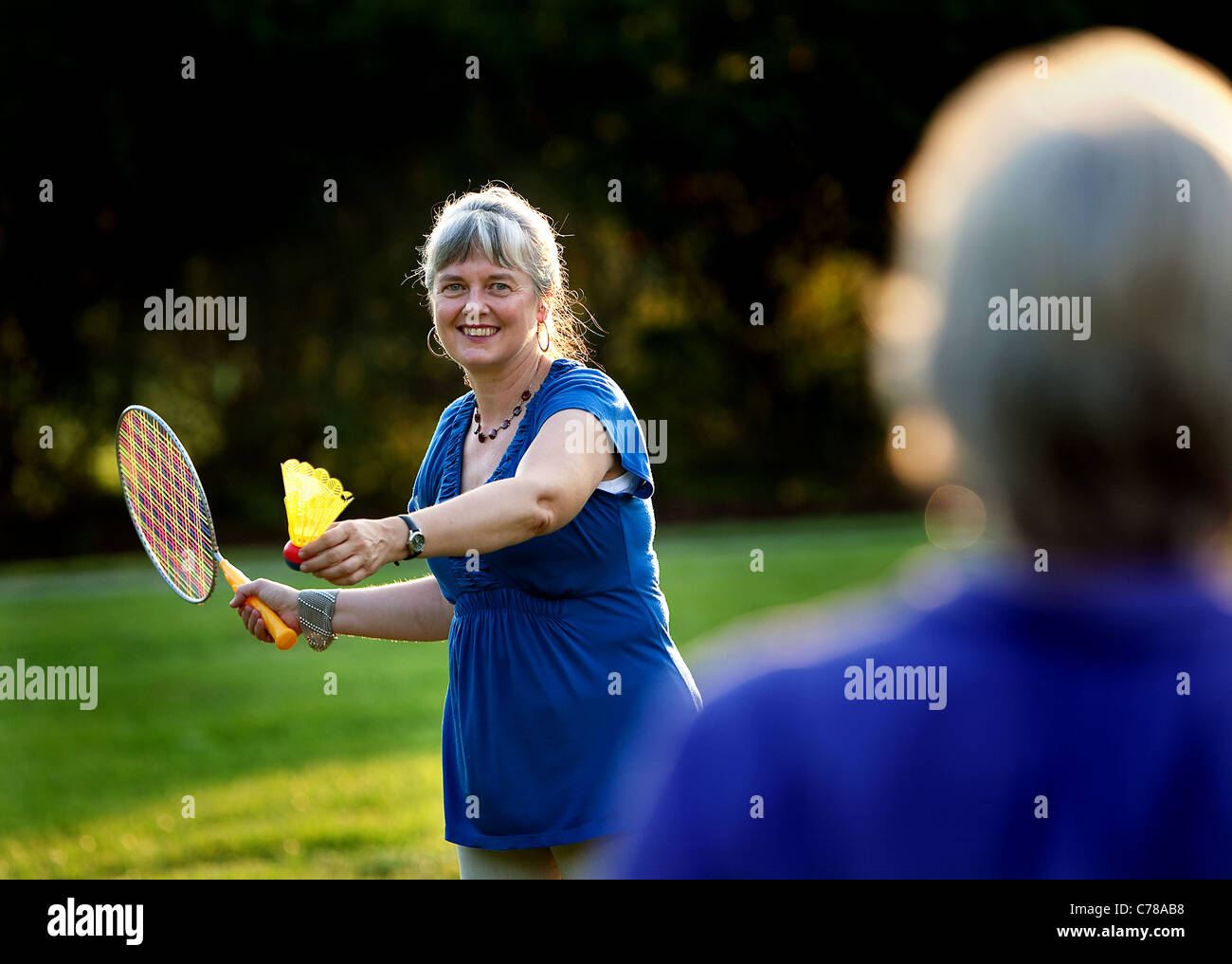 Lady keeps active by playing badminton Stock Photo - Alamy Lady keeps active by playing badminton Stock Photo - Alamy