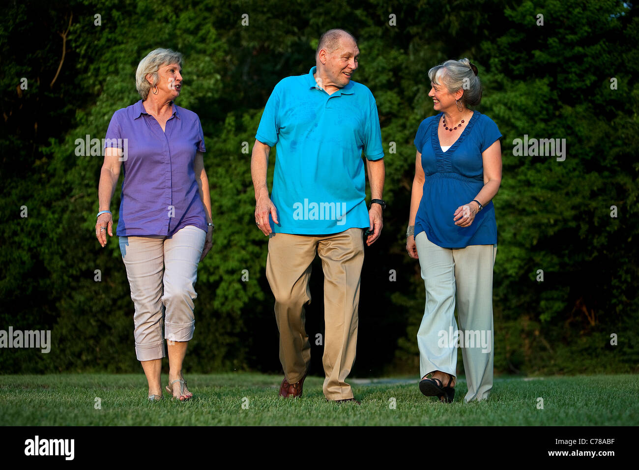 Senior citizens walk in a park Stock Photo - Alamy