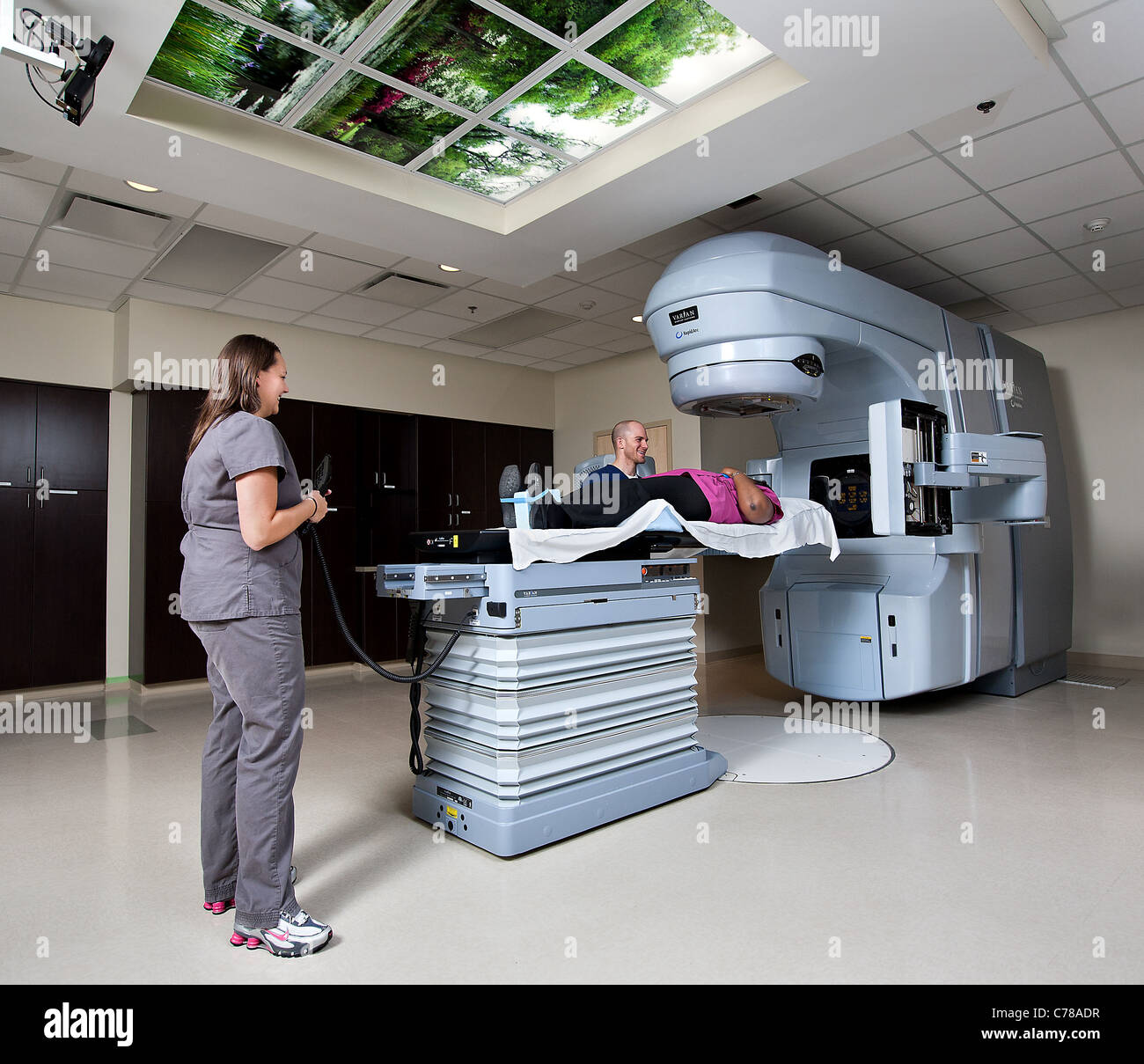 Nurse and patient in cancer center radiology room Stock Photo - Alamy