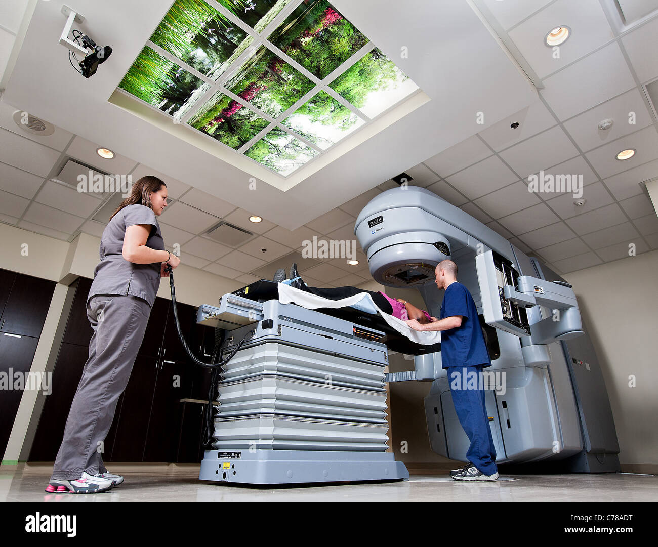 Nurse and patient in cancer center radiology room Stock Photo - Alamy