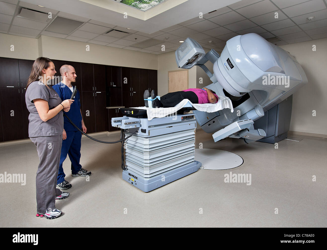 Nurse and patient in cancer center radiology room Stock Photo - Alamy