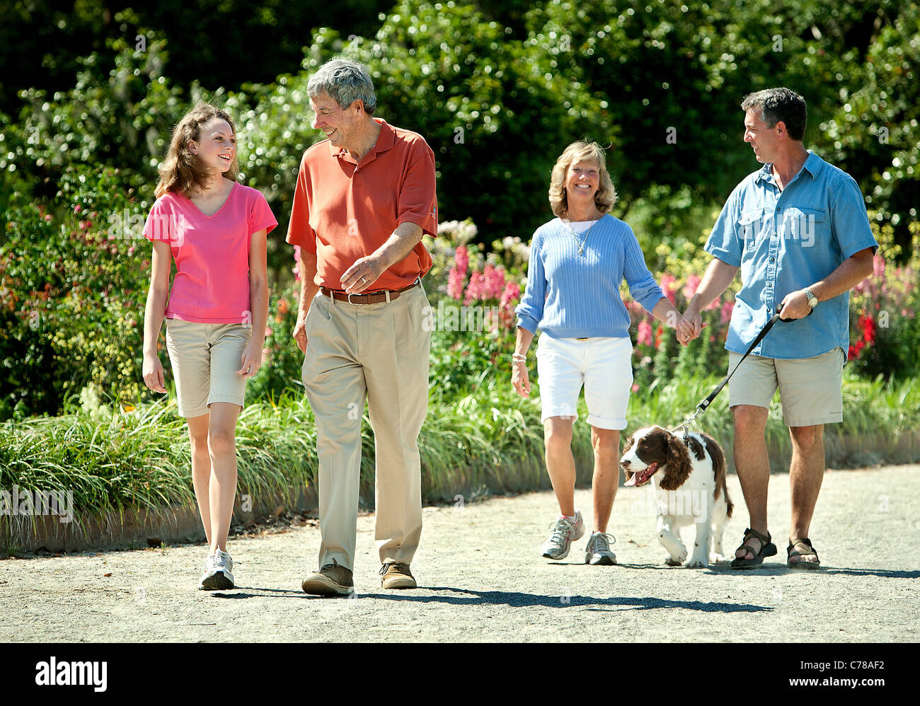 A multi-generational family enjoys a walk in the park Stock Photo - Alamy