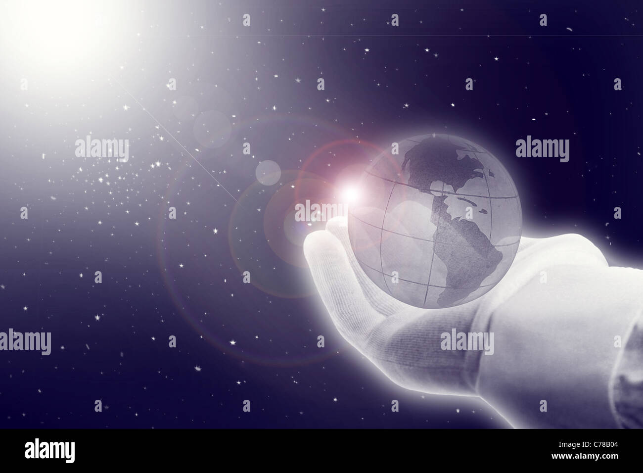 arm holding earth in sunshine Stock Photo - Alamy