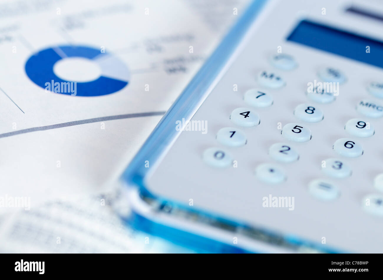 Business concept - Calculator and Charts Stock Photo - Alamy