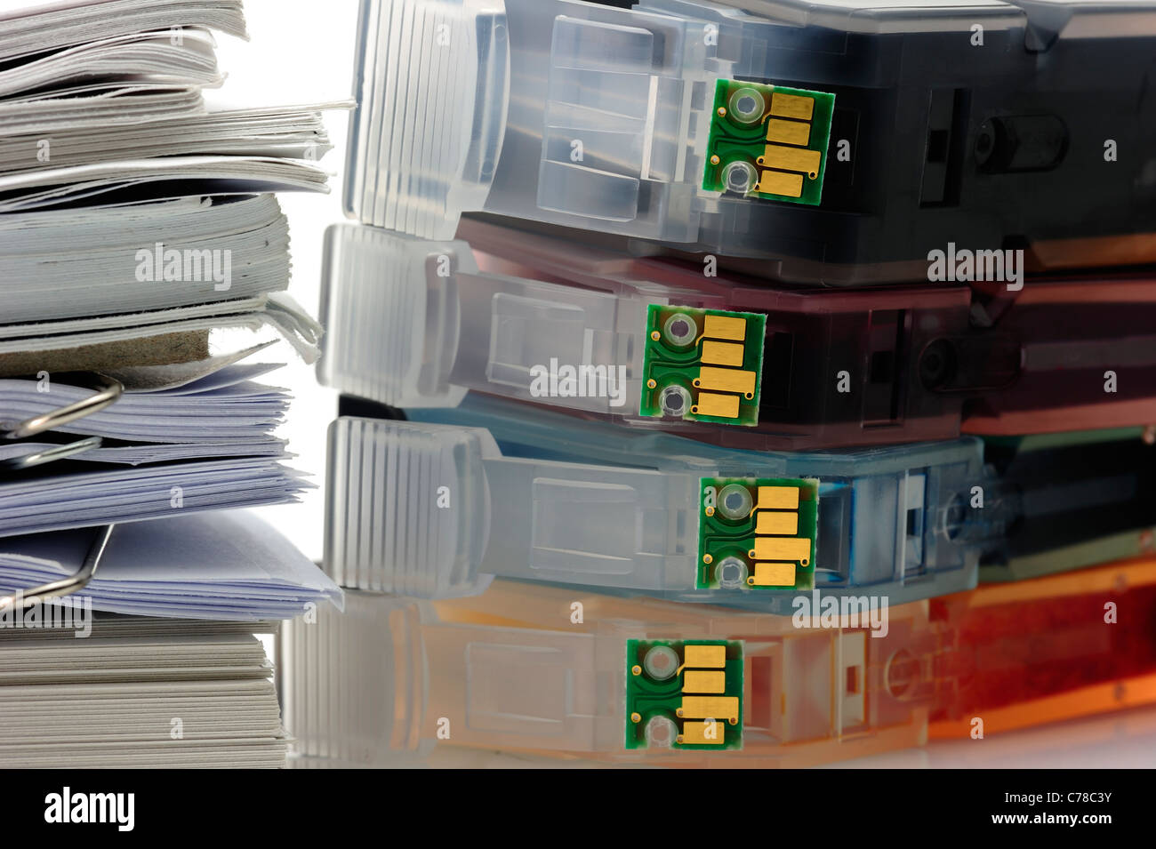 Empty ink tanks and a bunch of papers Stock Photo - Alamy