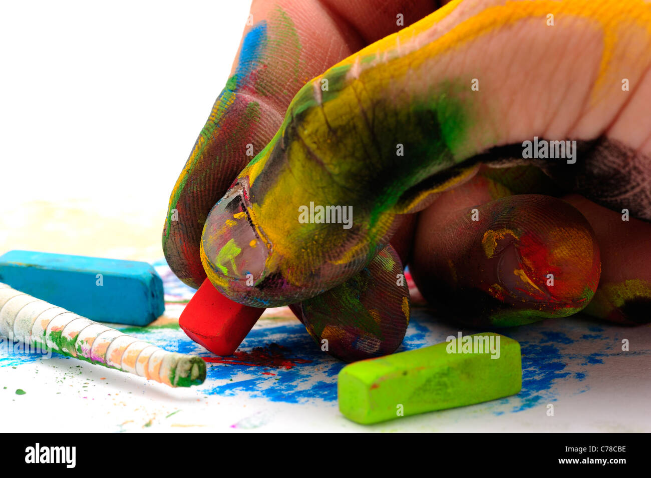 Male hand holding a red pastel stick Stock Photo - Alamy
