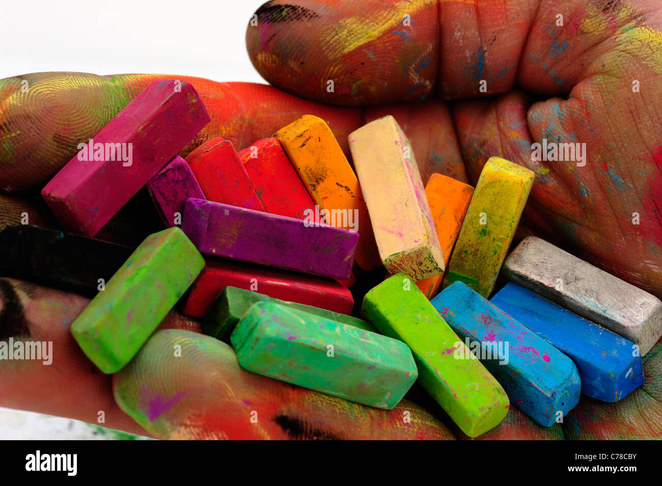 Male hand holding pastel sticks Stock Photo - Alamy