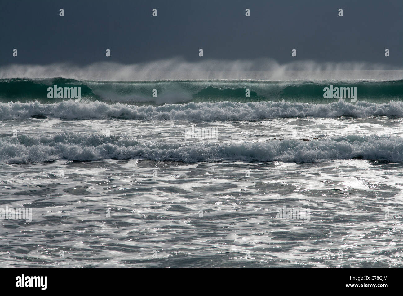 Windswept ocean waves ahead of a storm Stock Photo - Alamy