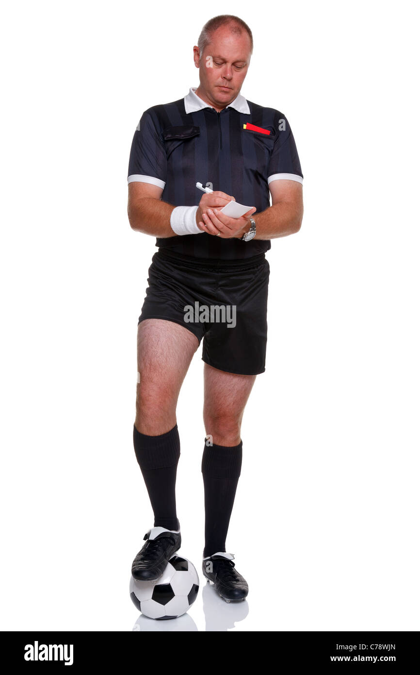 Full length photo of a football or soccer referee with ball writing in ...