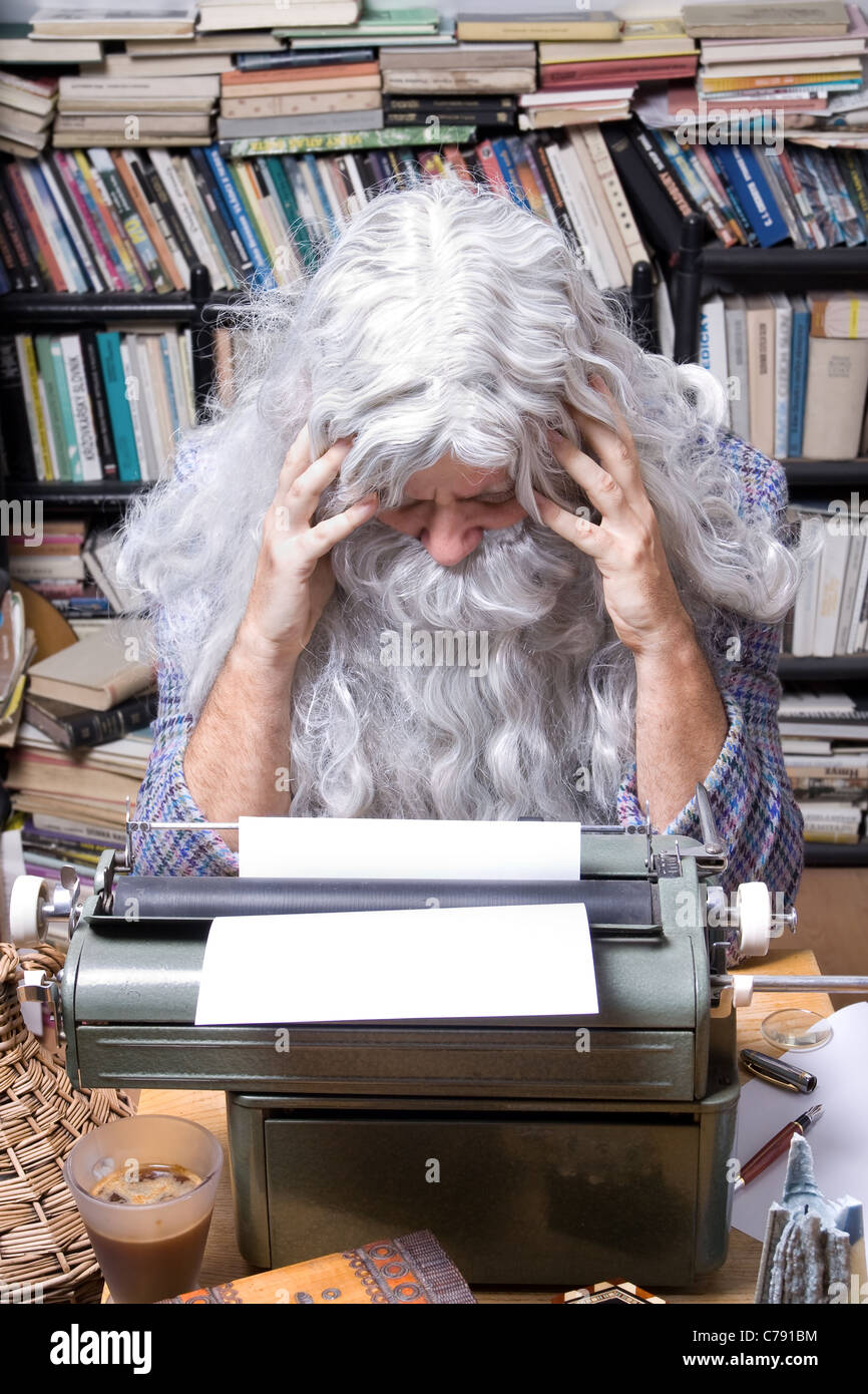 Author working on a old typewriter Stock Photo - Alamy