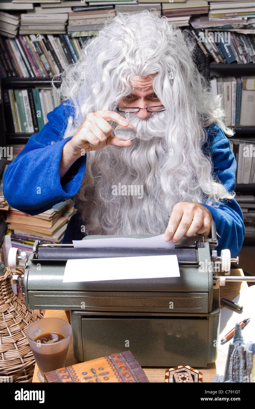 Author working on a old typewriter Stock Photo - Alamy