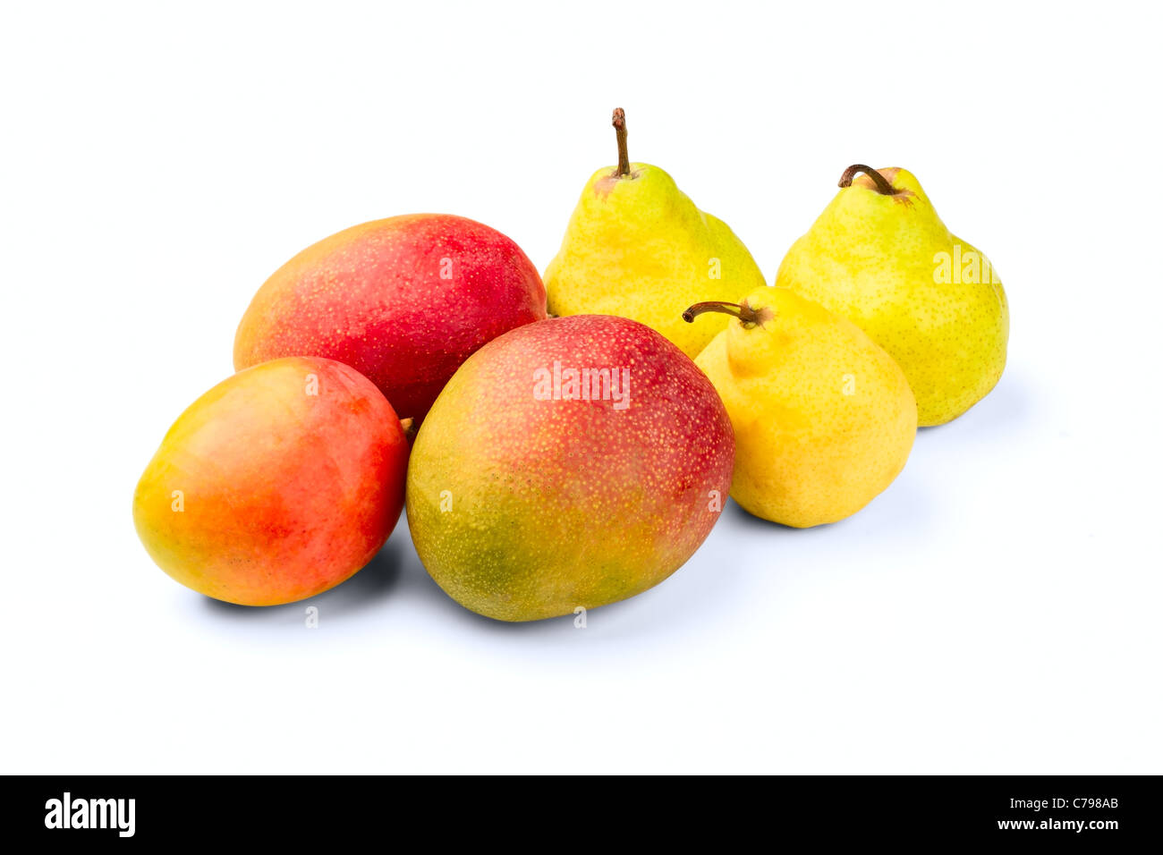 Three mangoes and three pears isolated on a white background Stock ...