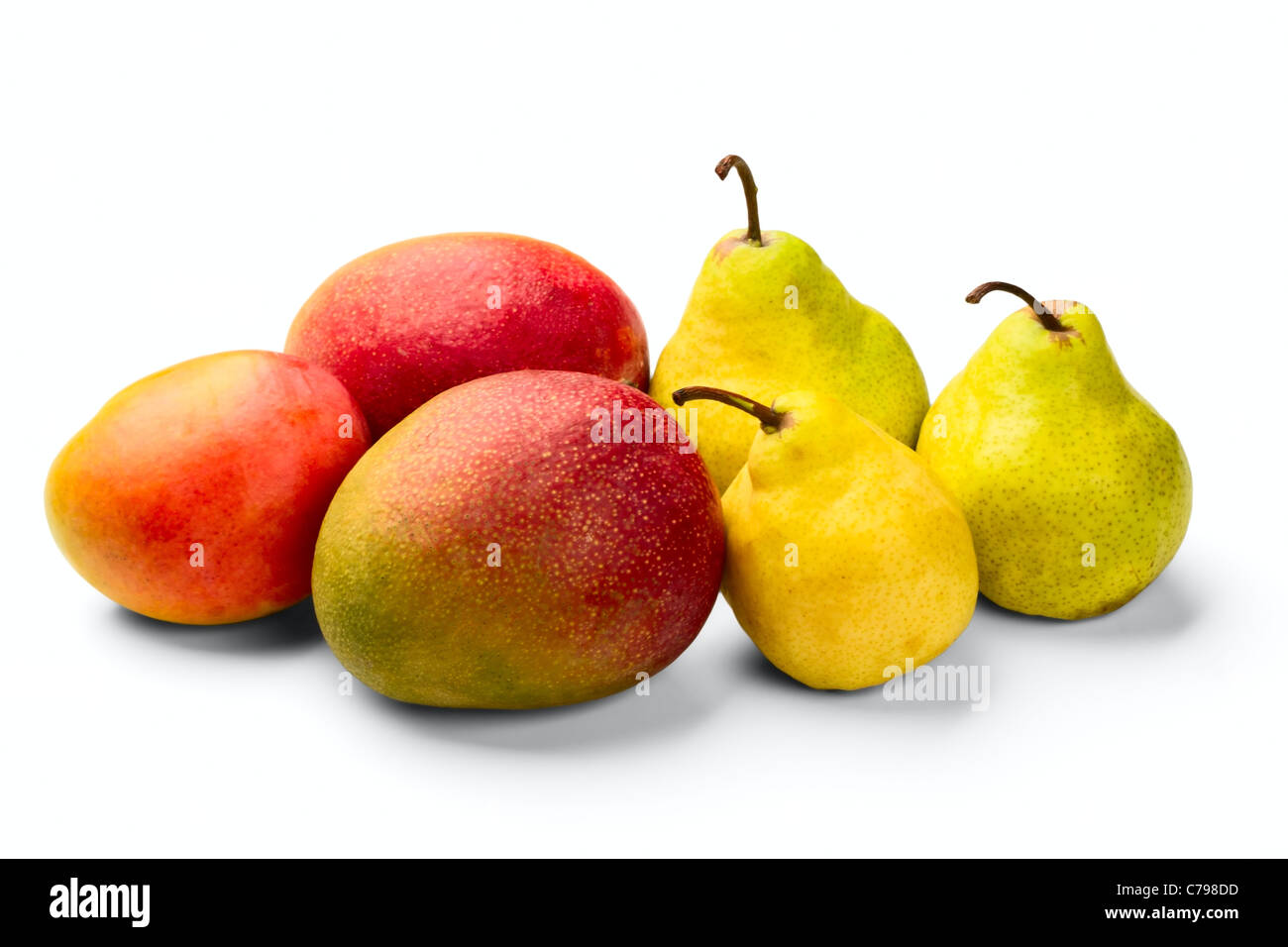 Three mangoes and three pears isolated on a white background Stock ...