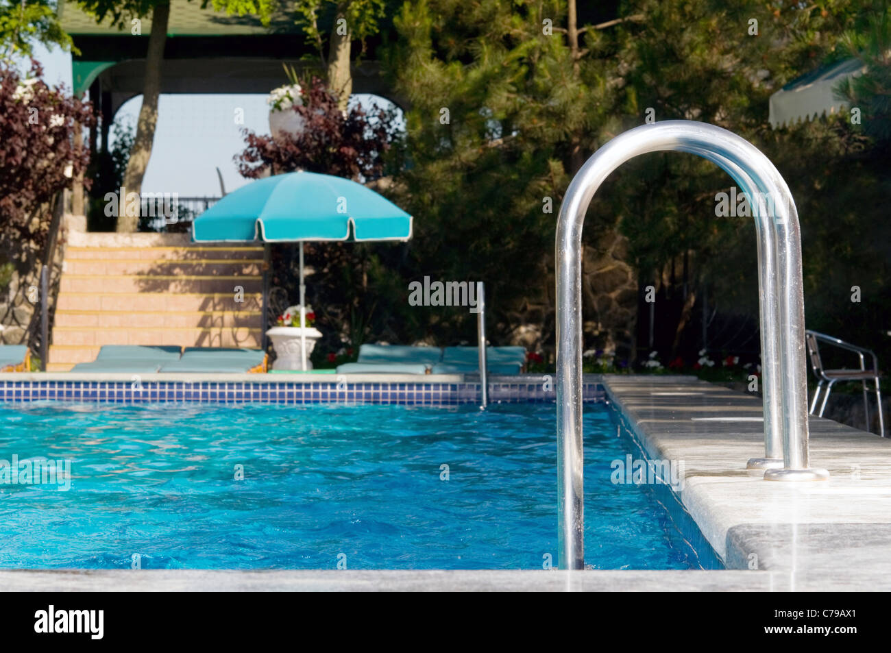 swimming pool with tables for leisure travelers at the hotel Stock ...