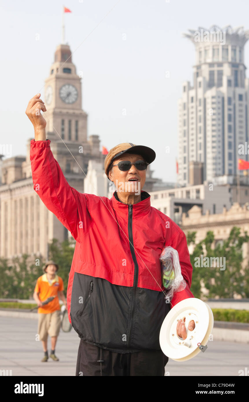 Man flying kite, The Bund; Shanghai; China Stock Photo - Alamy