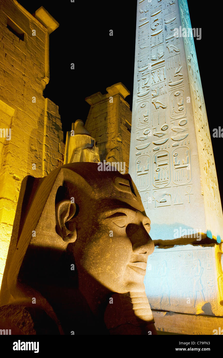 Head of Ramses II and obelisk at night, Luxor Temple, Luxor, Egypt ...