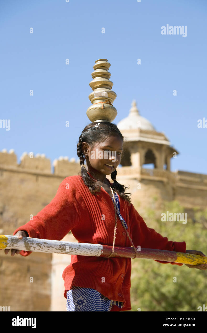 A child acrobat performs at the Fort Gate entrance to Jaisalmer Fort ...
