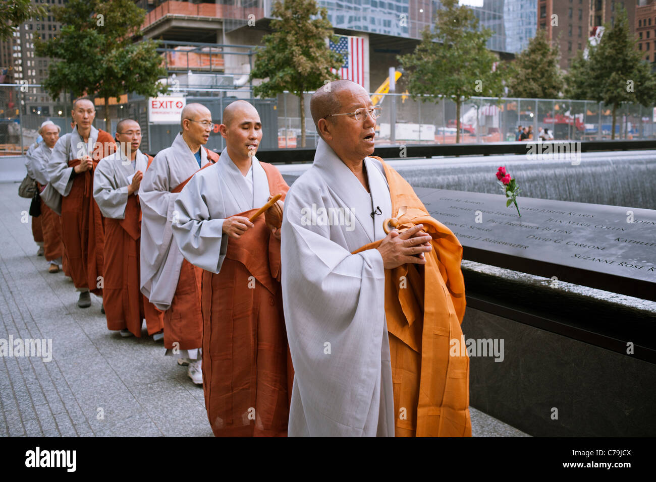 Buddhist monks visit and pray in the National 9/11 Memorial Plaza in ...