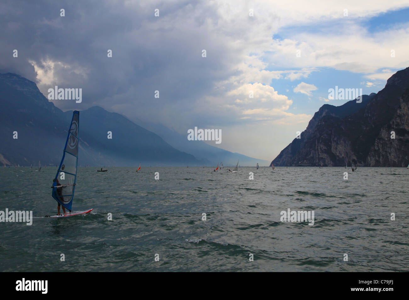 Wind surfing on the river in Italy Stock Photo - Alamy
