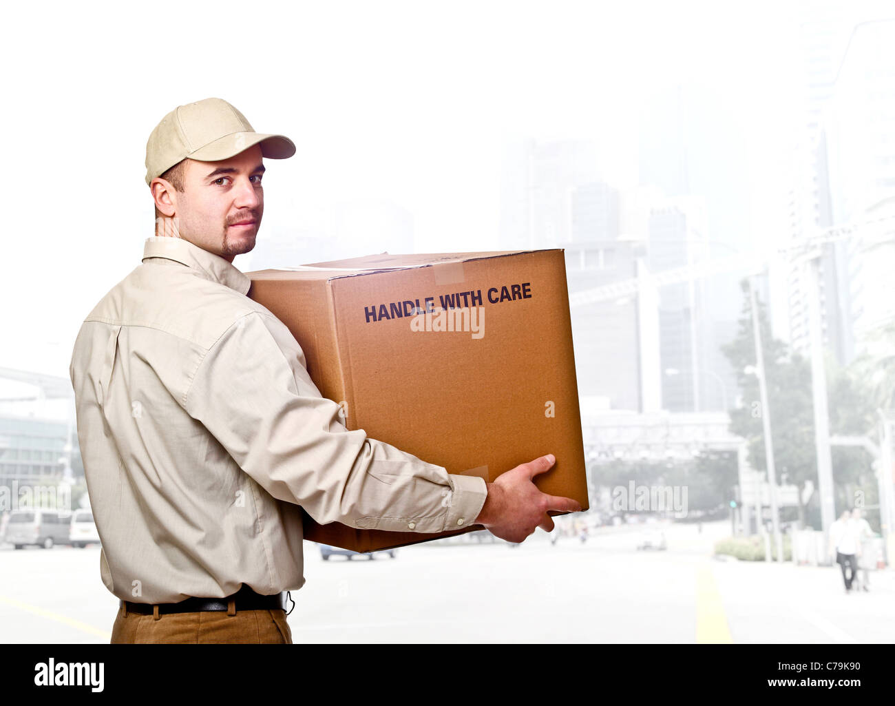 confident man holding a box Stock Photo - Alamy