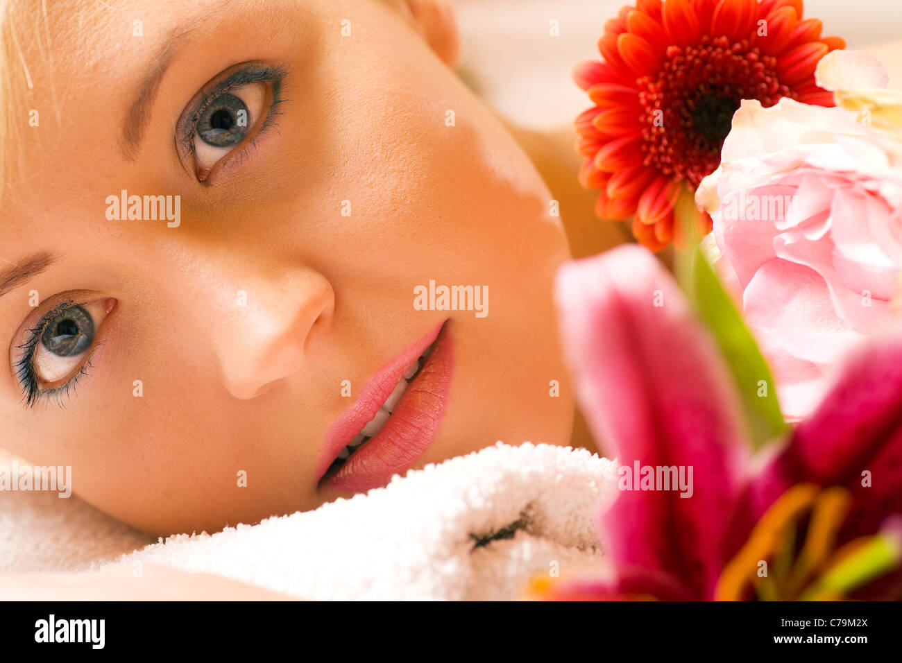 Girl with flowers in a spa situation feeling visibly good Stock Photo ...