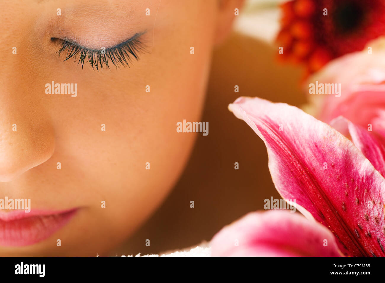 Girl with flowers in a spa situation feeling visibly good Stock Photo ...