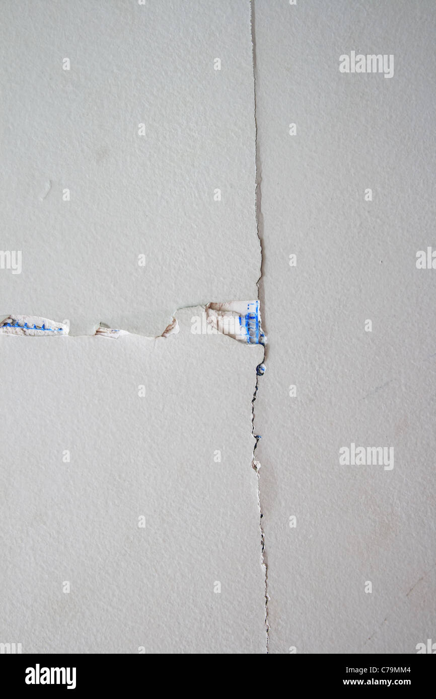 cracked sheet rock wall for background texture Stock Photo - Alamy