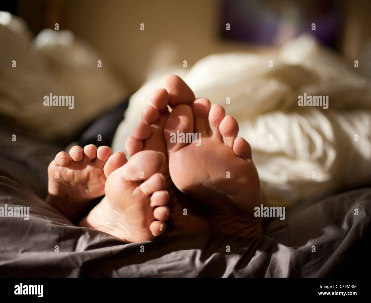 Couple bed close up feet hi-res stock photography and images - Alamy