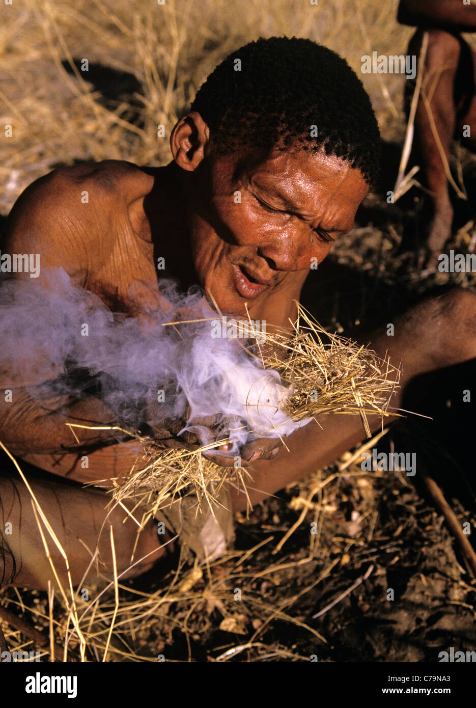 Bushman making fire Stock Photo - Alamy