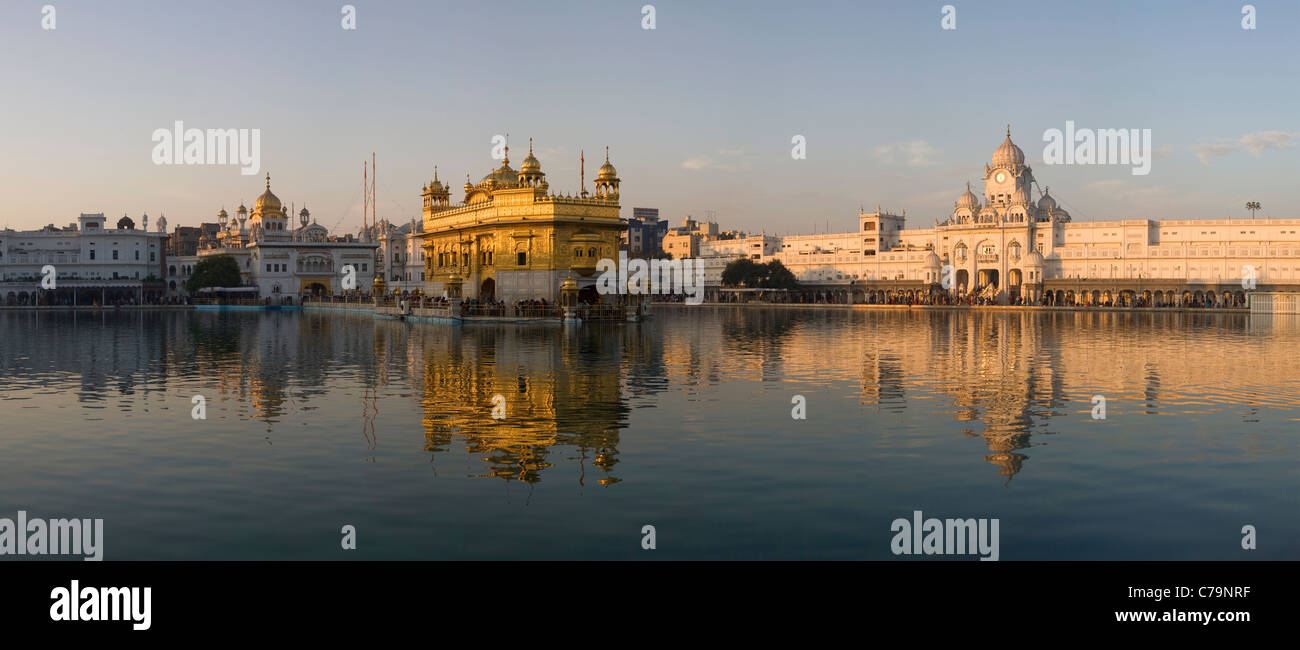 Panoramic view of the Sikh Golden Temple at sunset in the city of ...