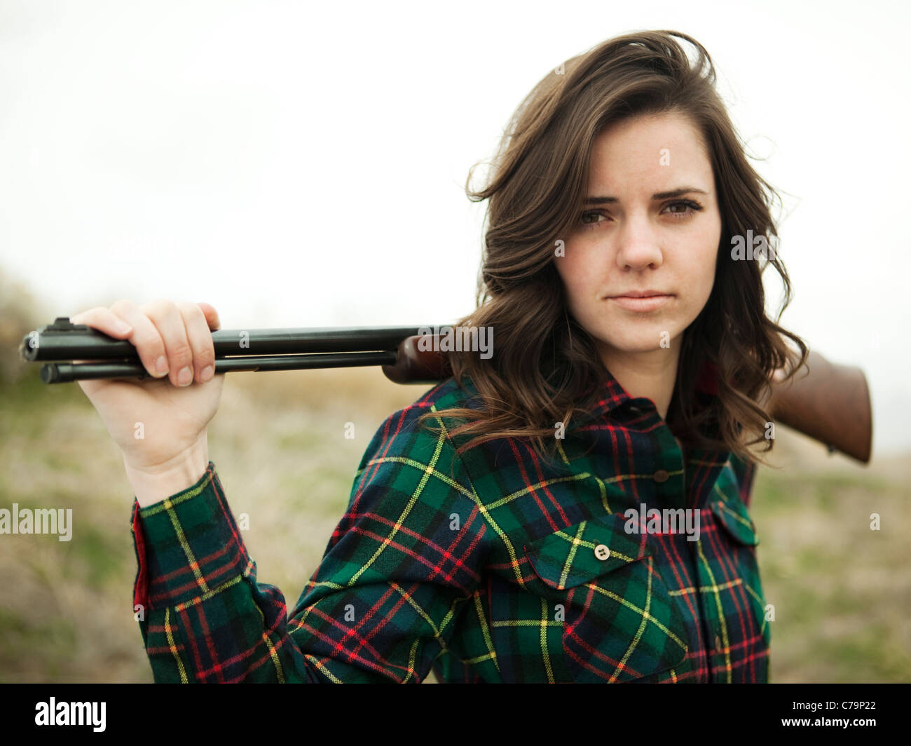 Young woman with hunting rifle hi-res stock photography and images - Alamy