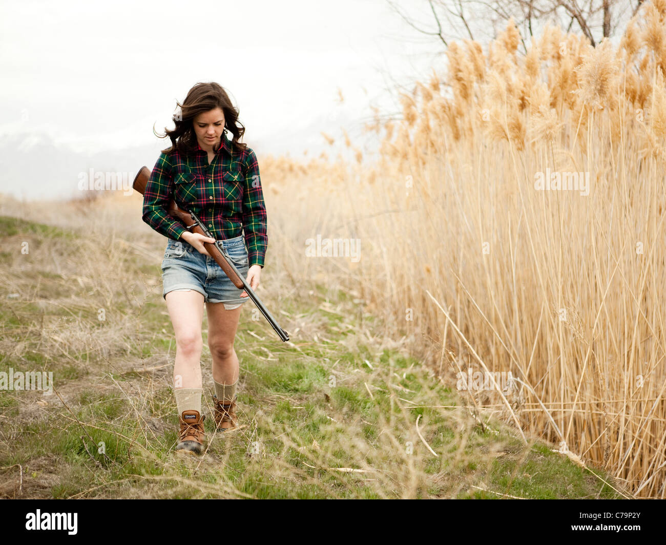 Young woman with hunting rifle hi-res stock photography and images - Alamy