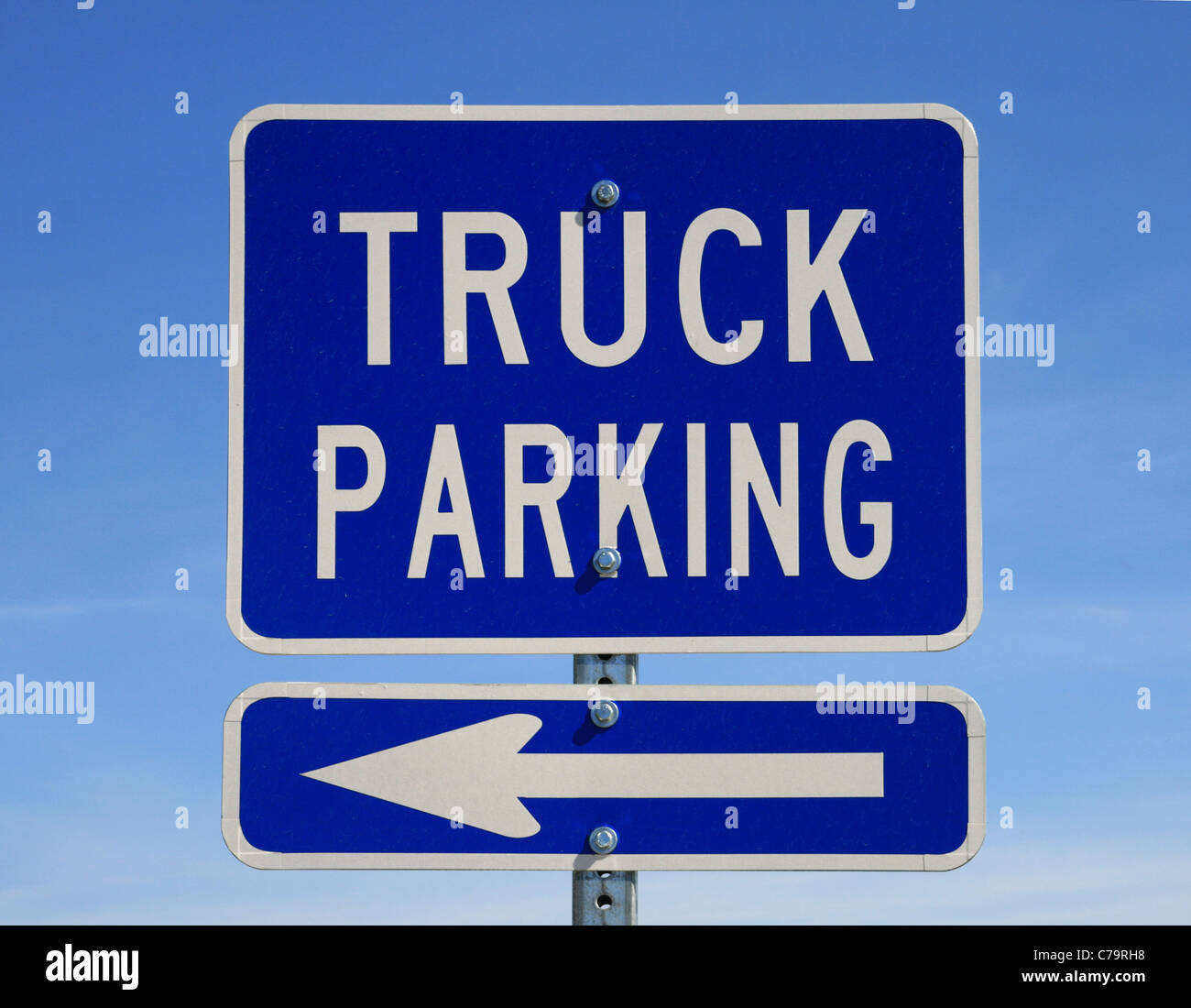 blue truck parking to the left sign with blue sky background Stock ...