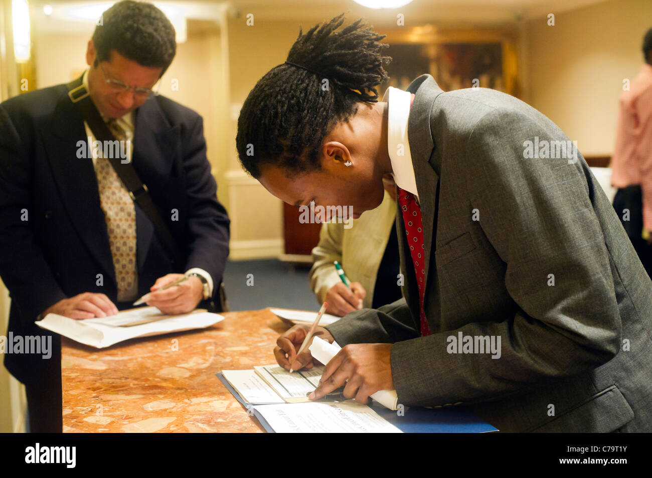 Job seekers attend a job fair in midtown in New York on Thursday ...