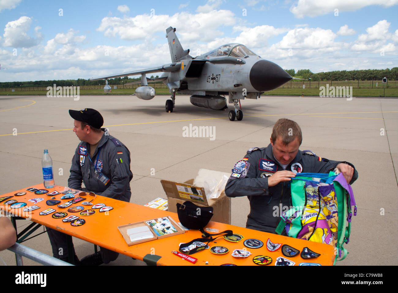 Two German pilots in front of their Tornado jet selling patches to ...