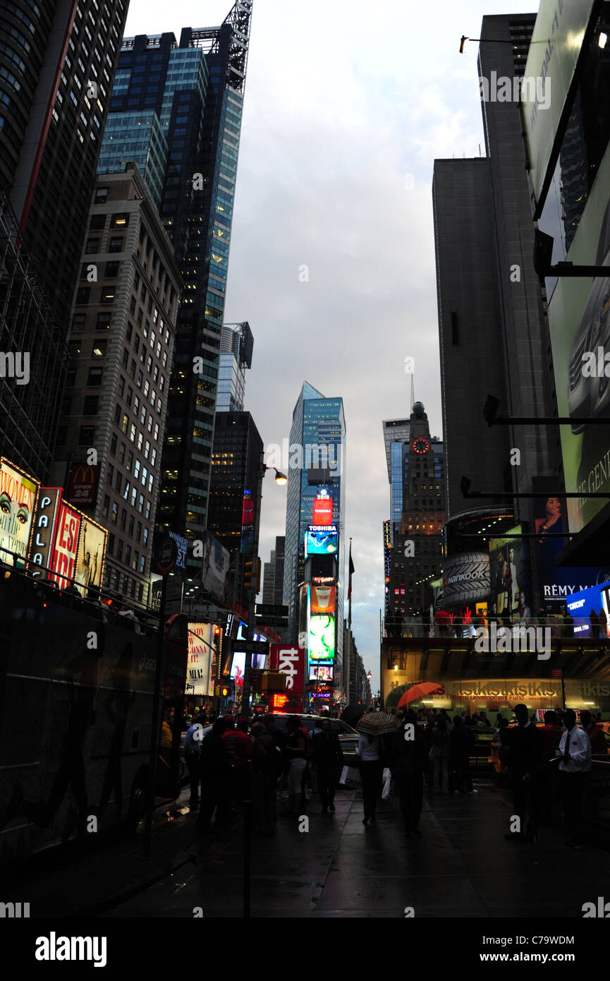 Evening twilight portrait Times Square neon skyscrapers, tour bus ...